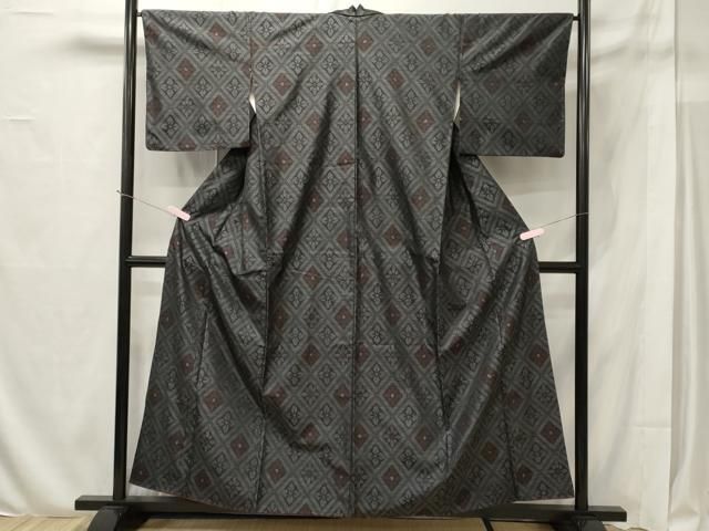 平和屋着物○本場大島紬 白大島 カタス7マルキ 人物風景花文 正絹