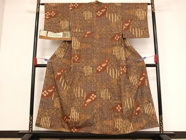 平和屋着物○伝統工芸士 七代目 吉澤与市 紬 絞り 幾何学花鳥文 証紙